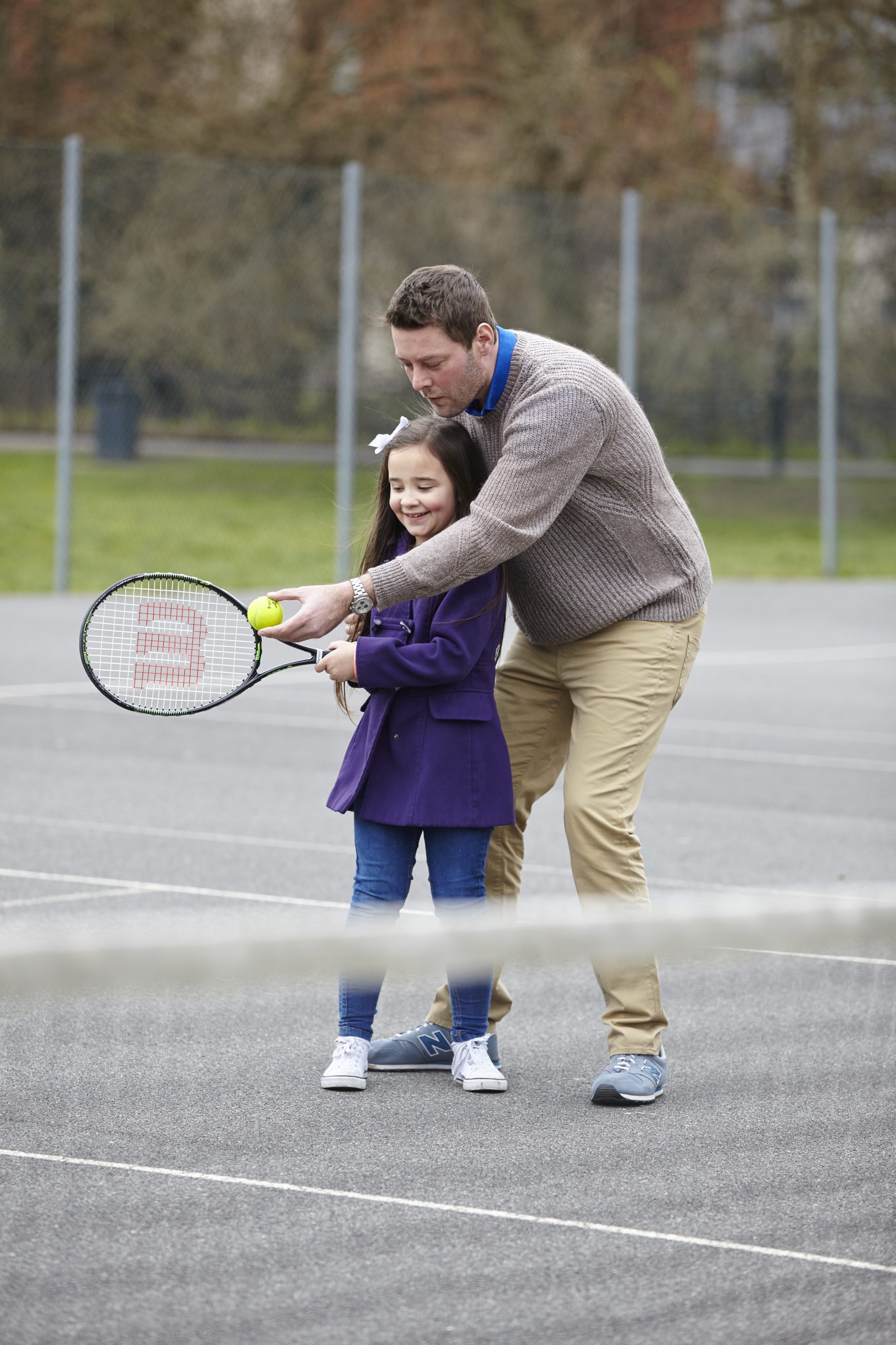 Dad coaching tennis 01 - First4Adoption
